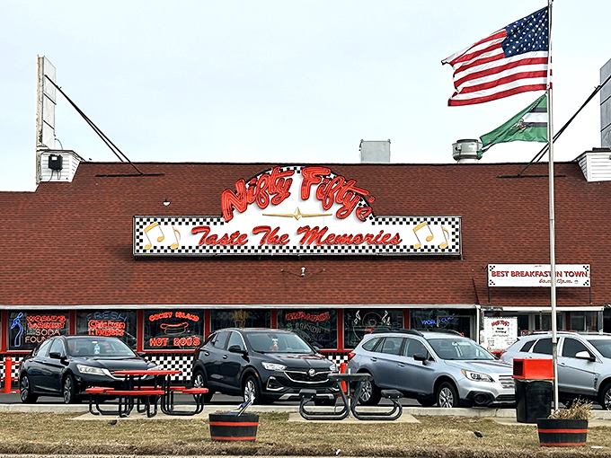 The neon-lit promise of "Taste The Memories" isn't just clever marketing&mdash;it's a time-traveling invitation backed by those iconic American flags waving you inside.