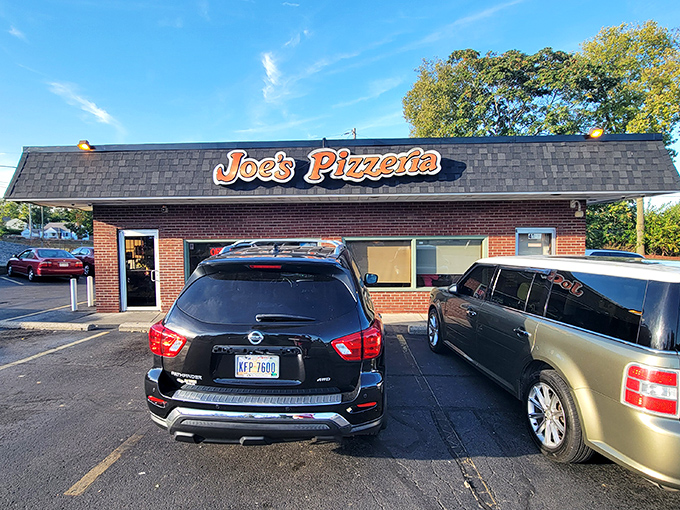 Joe's Pizzeria stands proudly on Airway Road, its classic brick exterior and vintage sign a beacon for pizza pilgrims seeking authentic flavor.