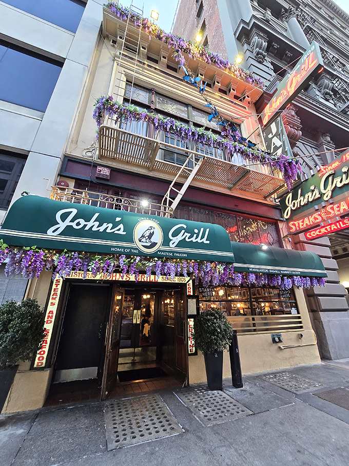 The iconic green awning of John's Grill beckons like an old friend, promising three essential food groups: steaks, seafood, and cocktails.