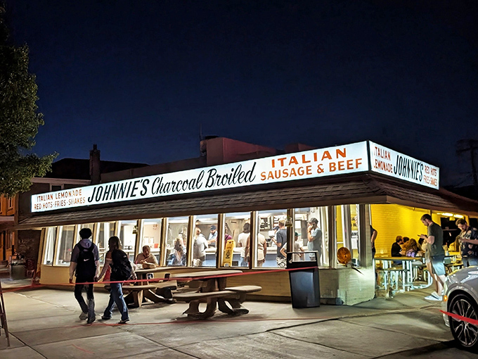 Johnnie's glows like a beacon in the night, drawing hungry pilgrims to its hallowed grounds. The neon promise of Italian beef salvation awaits.