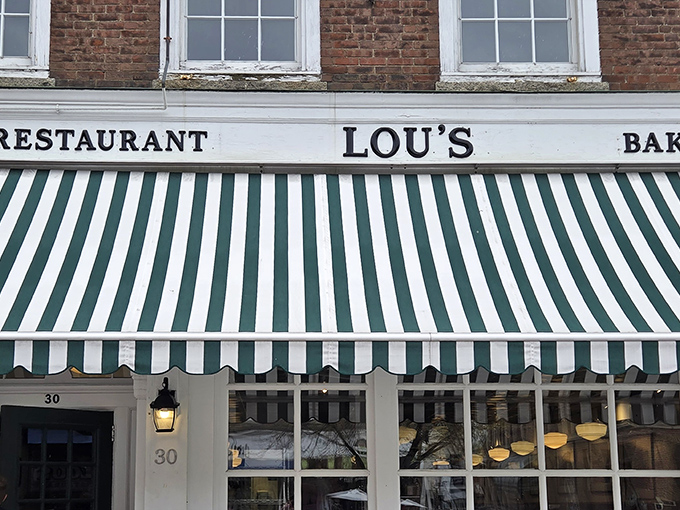 That iconic green and white striped awning isn't just decoration&mdash;it's a beacon of breakfast hope on Hanover's Main Street, promising culinary salvation to hungry souls.