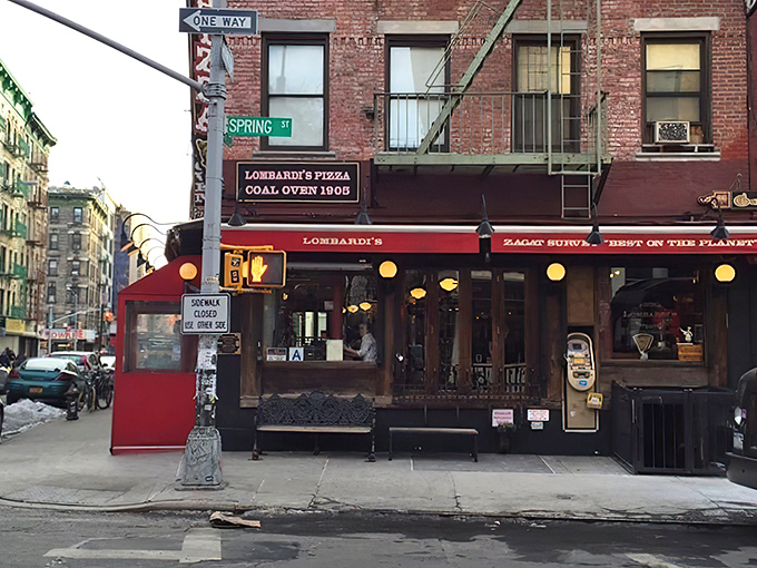 The iconic red awning of Lombardi's on Spring Street beckons pizza lovers like a culinary lighthouse in Little Italy's brick-lined streets.