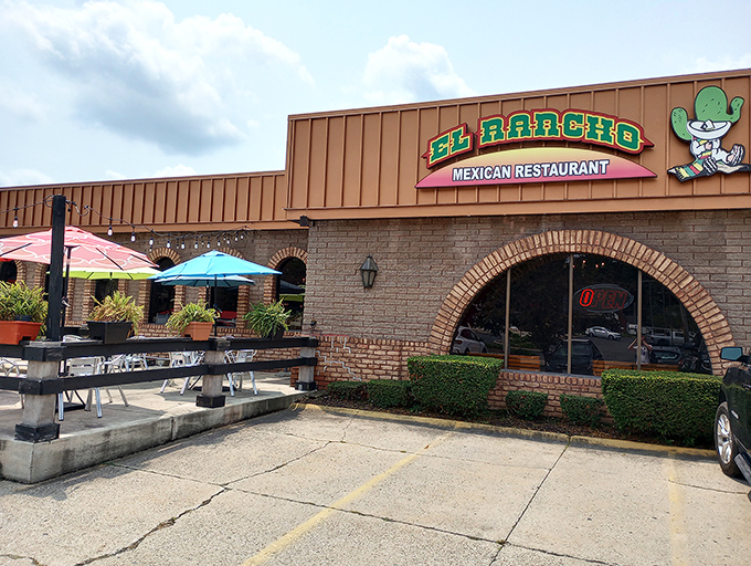 The welcoming patio invites you to dine al fresco, where colorful umbrellas promise shade and Mexican flavors await.