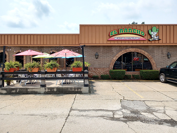 The unassuming exterior of El Rancho Mexican Restaurant hides culinary treasures within. Like finding a diamond in a strip mall setting.