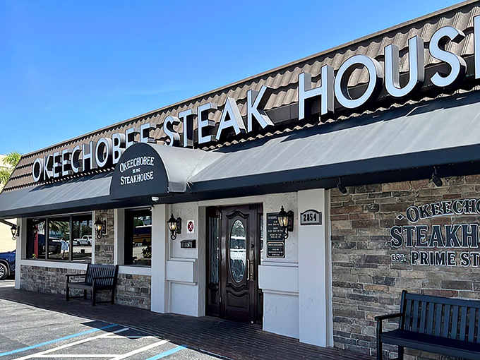 The unassuming stone facade of Okeechobee Steak House hides a carnivorous paradise within. Like finding out your quiet neighbor secretly knows how to tango professionally.