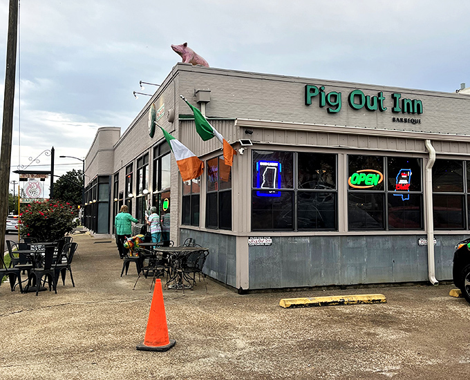 The iconic pink pig stands guard atop Pig Out Inn, a beacon for BBQ pilgrims in Natchez.