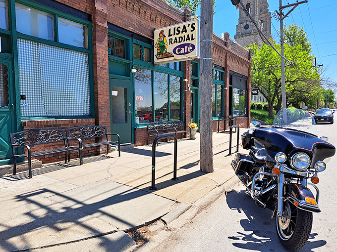 The classic brick exterior of Lisa's Radial Cafe stands as a beacon of breakfast hope on an Omaha street corner, complete with vintage charm.
