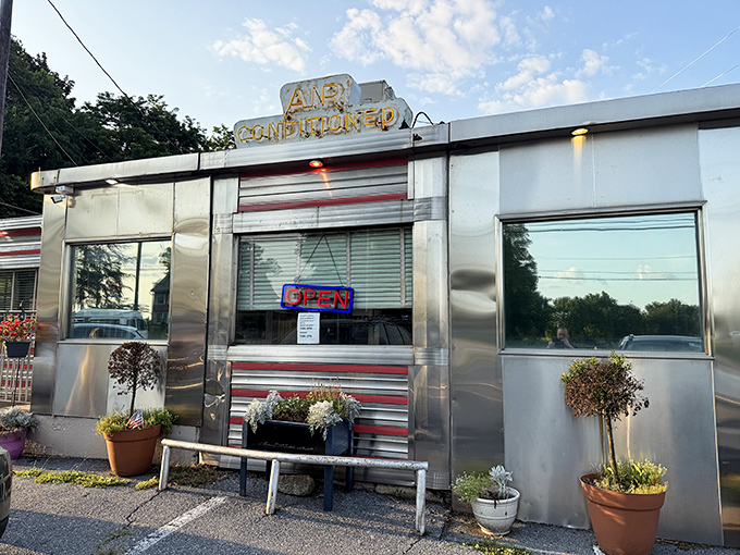 The time machine awaits! Route 30 Diner's gleaming stainless steel exterior with classic red stripes promises a journey back to simpler, more delicious times.