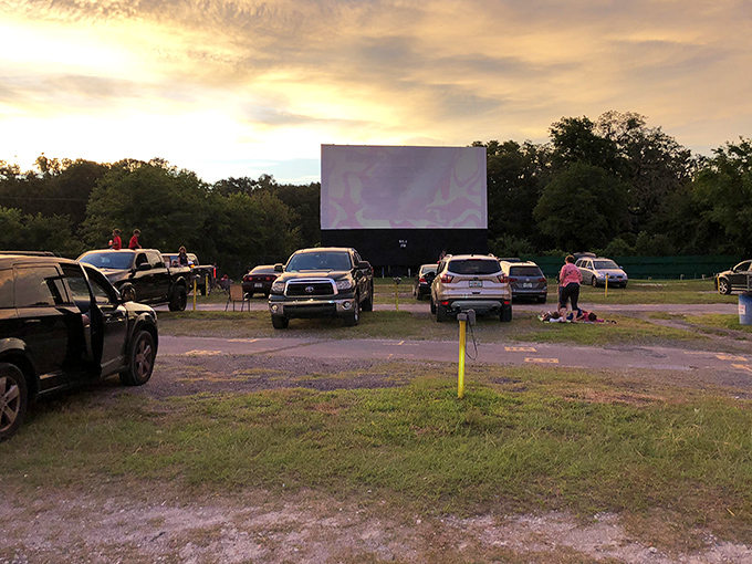 Sunset at the Joy-Lan creates that perfect golden-hour glow, where pickup trucks become luxury boxes and the Florida sky puts on its own pre-show spectacle.