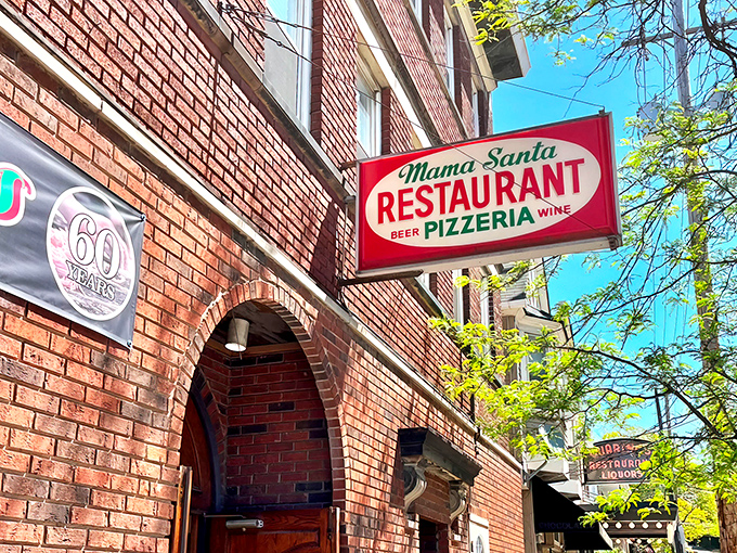 The brick facade of Mama Santa's stands like a time capsule on Mayfield Road, its vintage sign promising Italian comfort that Cleveland has embraced for generations.