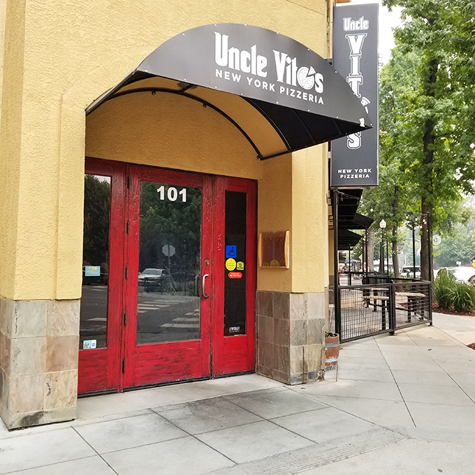 Those red doors aren't just an entrance&mdash;they're a portal to New York, no JFK layover required. The yellow walls practically shout "taxi!"