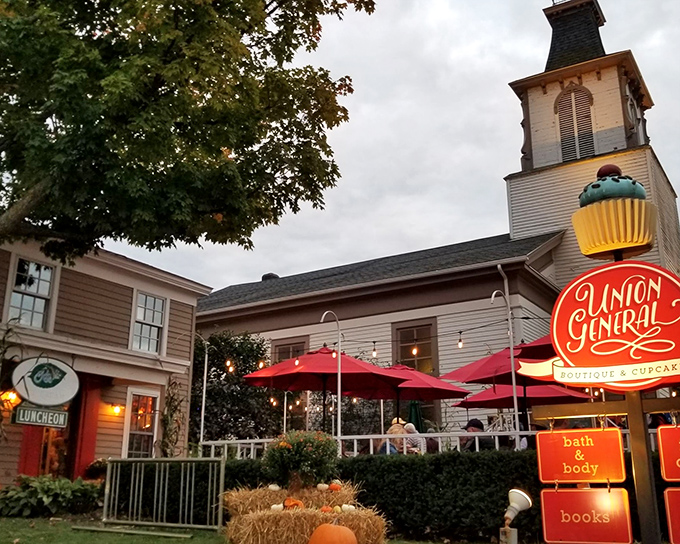 A church that feeds the soul and the stomach! Clarkston Union's historic exterior promises salvation from ordinary dining with its steeple and inviting red umbrellas.