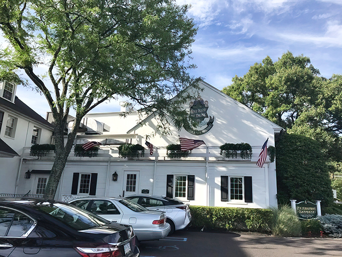 The stately white colonial facade of William Penn Inn welcomes guests with classic columns and brick steps&mdash;architectural elegance that whispers of Pennsylvania's storied past.