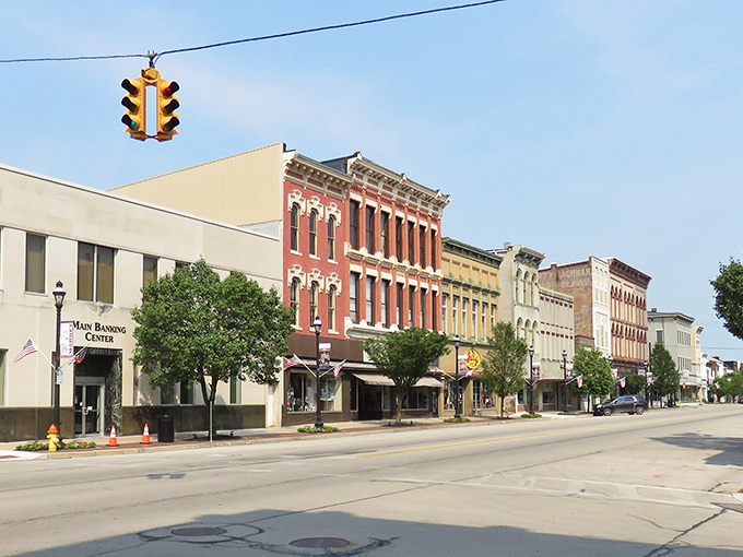 Broadway Street's historic buildings stand like colorful sentinels of small-town charm, where your Social Security check stretches further than your grandmother's patience.