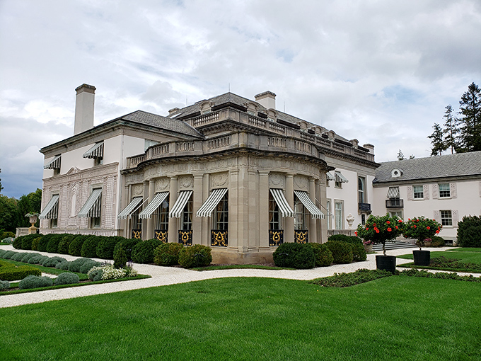 Nemours Estate's gleaming limestone fa&ccedil;ade and jaunty striped awnings&mdash;where Versailles meets Delaware in 77 rooms of pure architectural swagger.