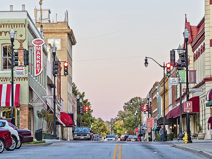 Main Street Newberry at dusk, where the vintage neon of Figaro Market glows like a beacon calling you home to small-town America.