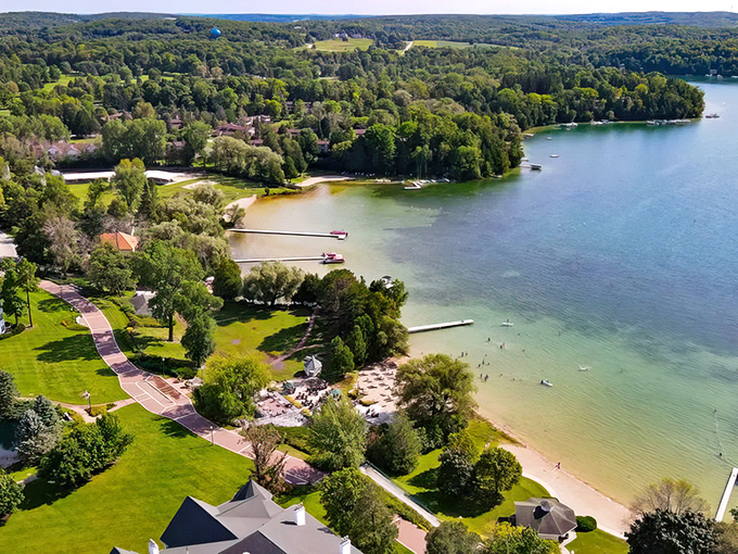 Crystal-clear waters meet lush greenery in this aerial view that proves Wisconsin has beaches worth bragging about. Paradise found!