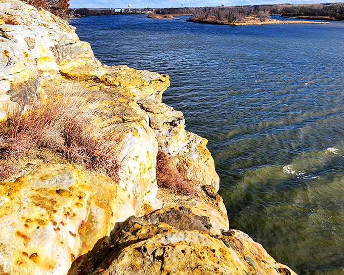 Nature's own infinity pool: the golden sandstone cliffs of Buffalo Rock meet the Illinois River in a geological handshake millions of years in the making.