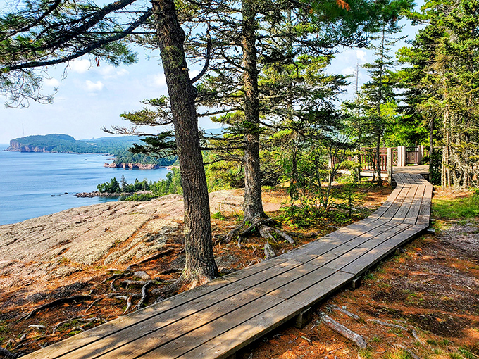 Nature's boardwalk to paradise! This wooden path along Lake Superior's rocky shore offers the kind of views that make smartphone cameras weep with inadequacy.