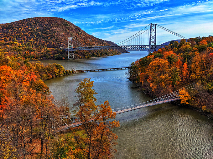 Mother Nature showing off her reflection game at Hessian Lake. The fall foliage creates a perfect mirror image that even the most expensive Instagram filter couldn't improve.