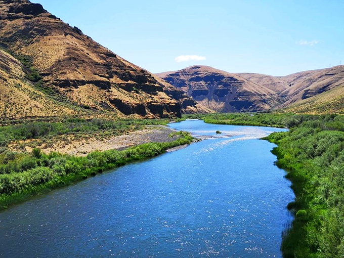 The John Day River carves its ancient path through towering canyon walls, creating a landscape that feels both timeless and ever-changing.