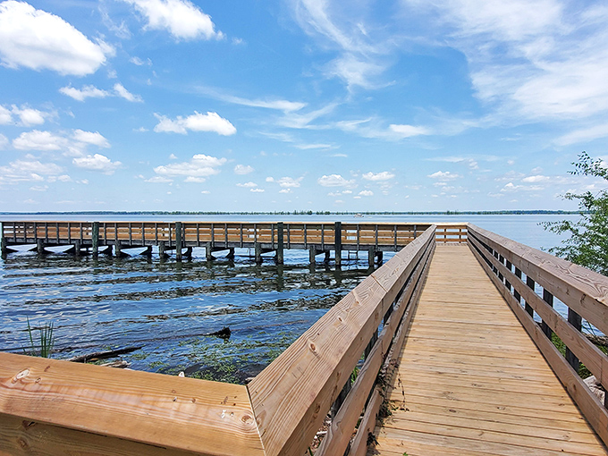 The wooden boardwalk stretches toward Lake Marion's horizon, inviting you to take that mental deep breath you've been postponing all week.