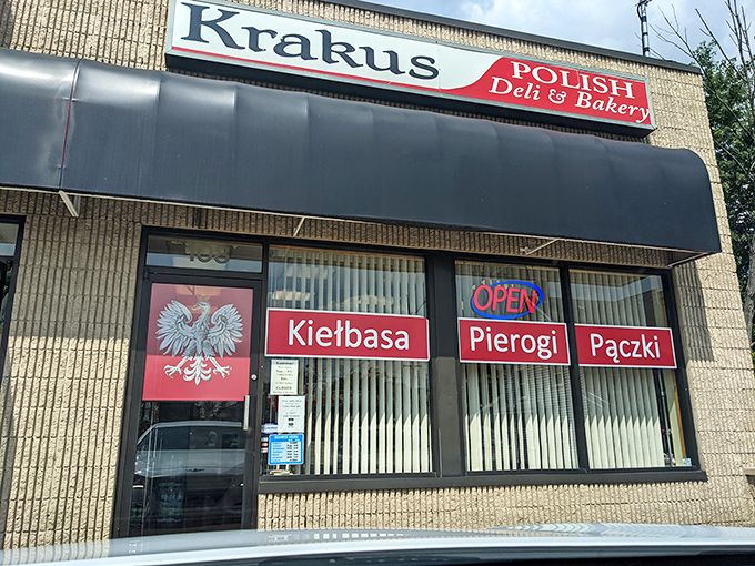The storefront beckons with its bold red signage and iconic Polish eagle emblem. Kiełbasa, Pierogi, Pączki &ndash; a trifecta of deliciousness awaits inside.