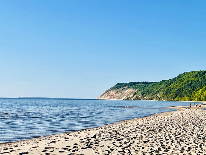 The view that makes you question why you ever bothered with Caribbean vacations. Esch Beach's pristine shoreline meets Lake Michigan's endless blue horizon.