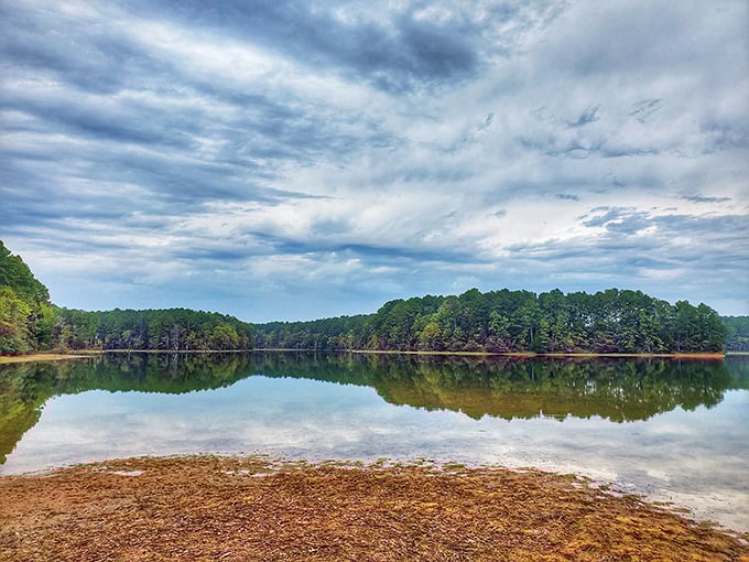 Mirror, mirror on the lake &ndash; Tishomingo's glassy waters reflect the sky so perfectly you might forget which way is up. Nature's own infinity pool.