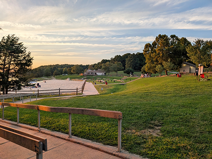 Sunset transforms Lake Anna's beach into a postcard come to life. Those wooden benches? Front-row seats to nature's evening show.