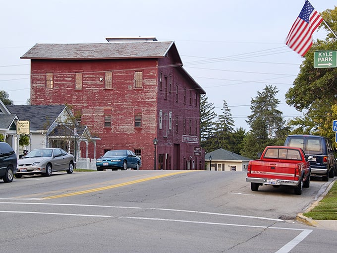The iconic red mill building stands as a sentinel of Tipp City's past, where history isn't just preserved&mdash;it's lived in daily.