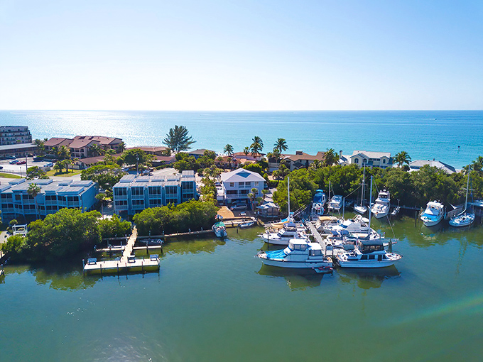 Where boats gently bob in protected waters while beachfront homes enjoy million-dollar views without the million-dollar price tags. That's the Englewood magic.