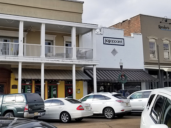 The sunny yellow exterior of Ajax Diner stands out on Oxford Square like a beacon of Southern comfort food promise.
