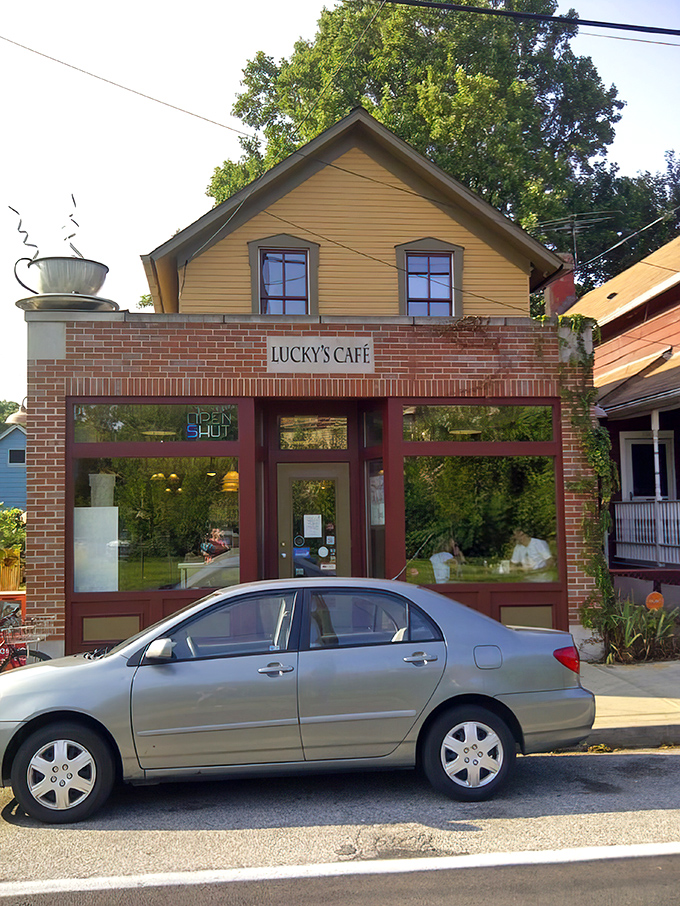 That charming coffee cup sculpture overhead is practically waving you inside for breakfast and a life-changing Reuben experience.