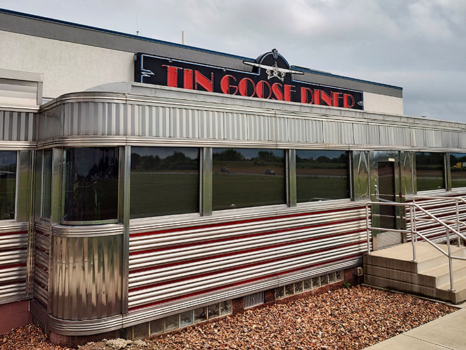 The gleaming silver exterior of Tin Goose Diner shines like a beacon of breakfast hope against the Ohio sky, promising nostalgic flavors and chrome-plated comfort.