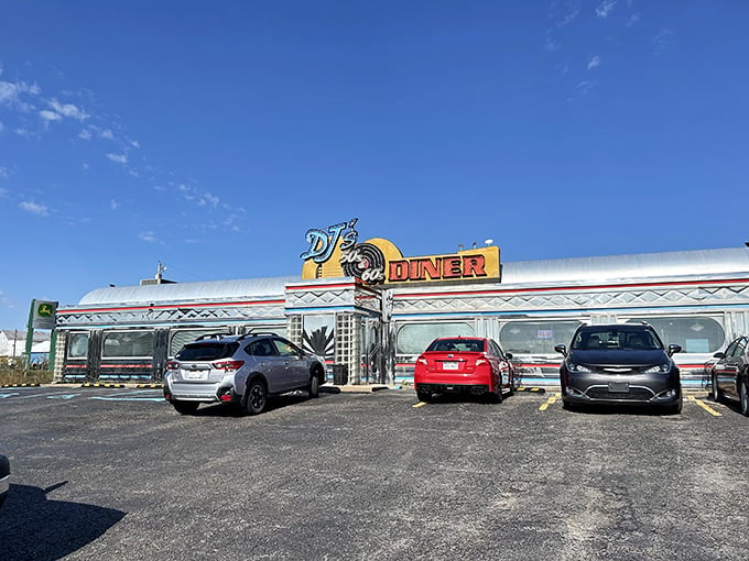 The gleaming silver exterior of DJ's 50's & 60's Diner shines like a beacon of nostalgia against the West Virginia sky, promising a time-traveling culinary adventure inside.