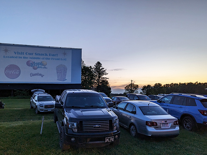 Cars gather under the twilight sky as the massive screen comes to life. Cinema's most democratic experience doesn't care what you drive&mdash;only that you showed up.