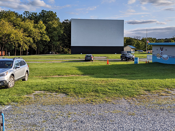 The massive white screen stands ready against the Pennsylvania sky, a blank canvas awaiting cinematic magic at dusk.