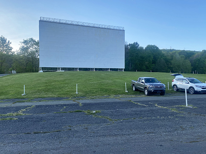 The iconic white screen of Circle Drive-In stands tall against Pennsylvania's blue sky, a monument to simpler times when entertainment was a communal affair.