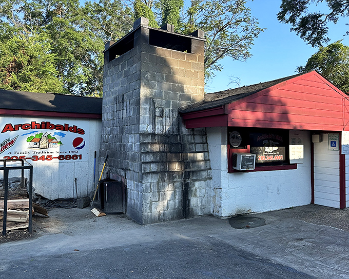The legendary pit stands like a smoke-stained monument to barbecue perfection. This isn't architecture; it's a temple of flavor.