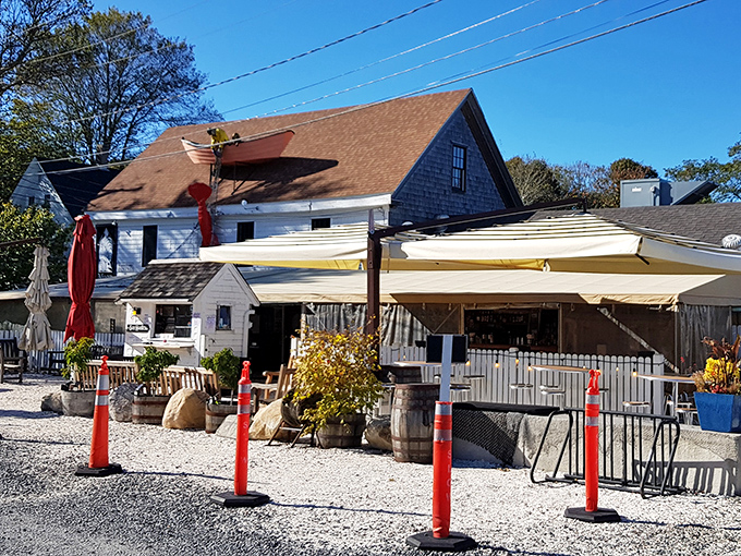The classic Cape Cod charm of Mac's Shack beckons from the roadside, where weathered shingles and white trim promise seafood nirvana just steps away.