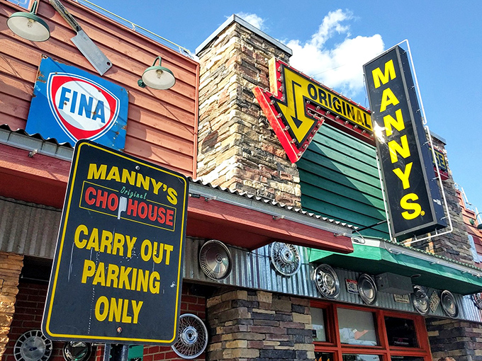 The unmistakable facade of Manny's Original Chophouse stands as a beacon to hungry travelers, promising carnivorous delights behind those rustic walls.