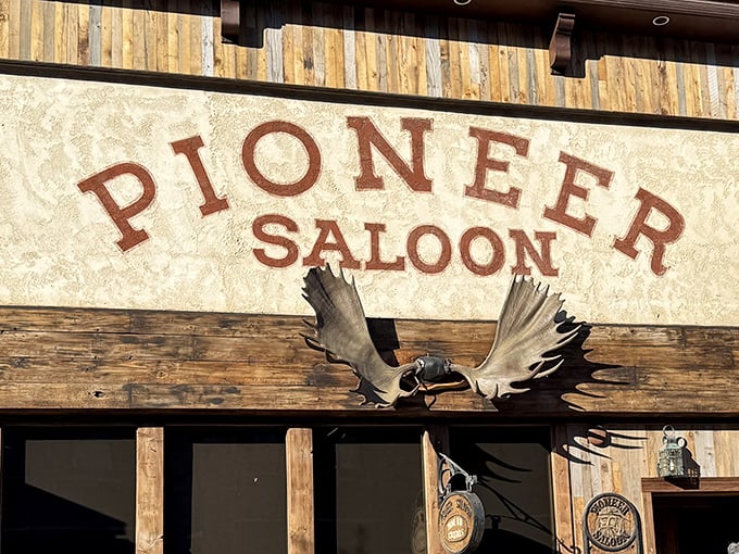 The iconic facade of Pioneer Saloon stands proudly in Ketchum, where rustic charm meets culinary legend beneath those bold red letters.