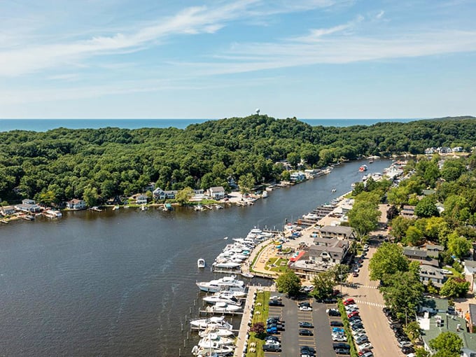 Aerial paradise! Saugatuck's harbor invites you to explore its waterways, where boats glide peacefully beneath Michigan's impossibly blue summer skies.