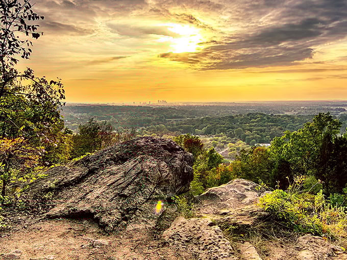 Nature's own IMAX theater unfolds at Hawk's View Overlook, where Birmingham's skyline meets the golden glow of sunset across an endless canvas.