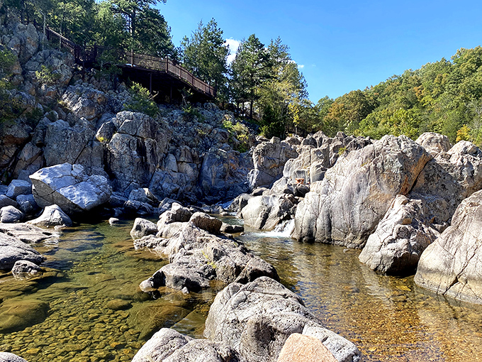Ancient pink granite creates nature's perfect water park, where the Black River squeezes through billion-year-old volcanic rock formations. Mother Nature's engineering at its finest!