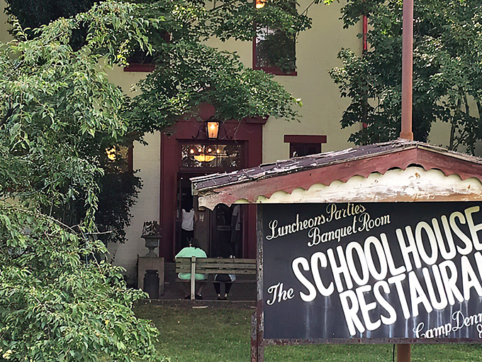 Approaching the entrance feels like discovering a secret hideaway. The historic schoolhouse structure promises lessons in flavor rather than arithmetic.