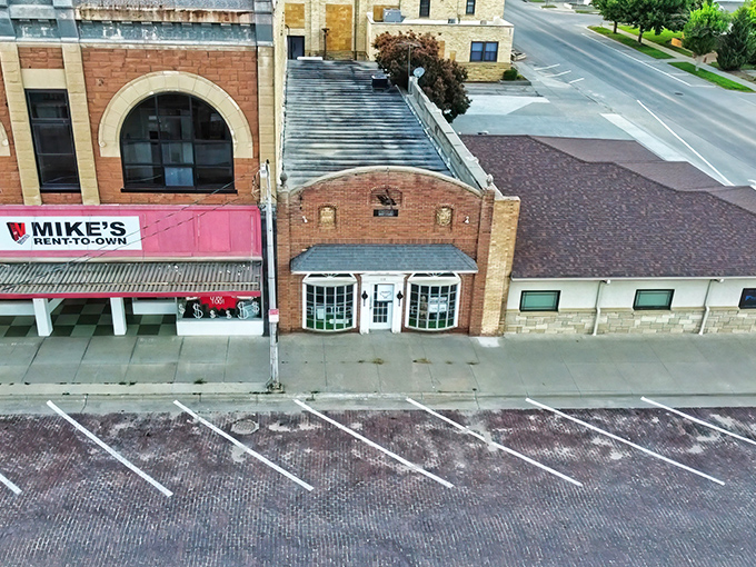 Historic brick buildings line Beloit's Main Street, where Mike's Rent-to-Own stands as a testament to the town's practical approach to life and affordability.