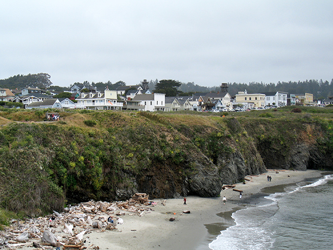 Perched dramatically on rugged cliffs, Mendocino's white Victorian homes stand like sentinels watching over the Pacific, a New England postcard somehow delivered to California's coast.