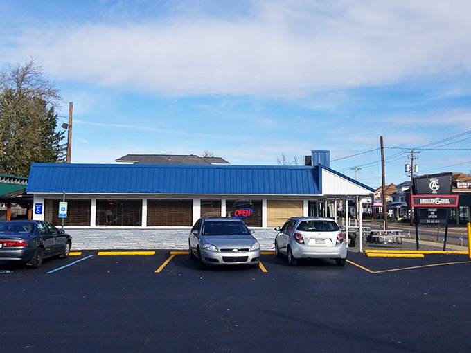 That blue-roofed building holds secrets your taste buds desperately need to discover on a sunny afternoon.